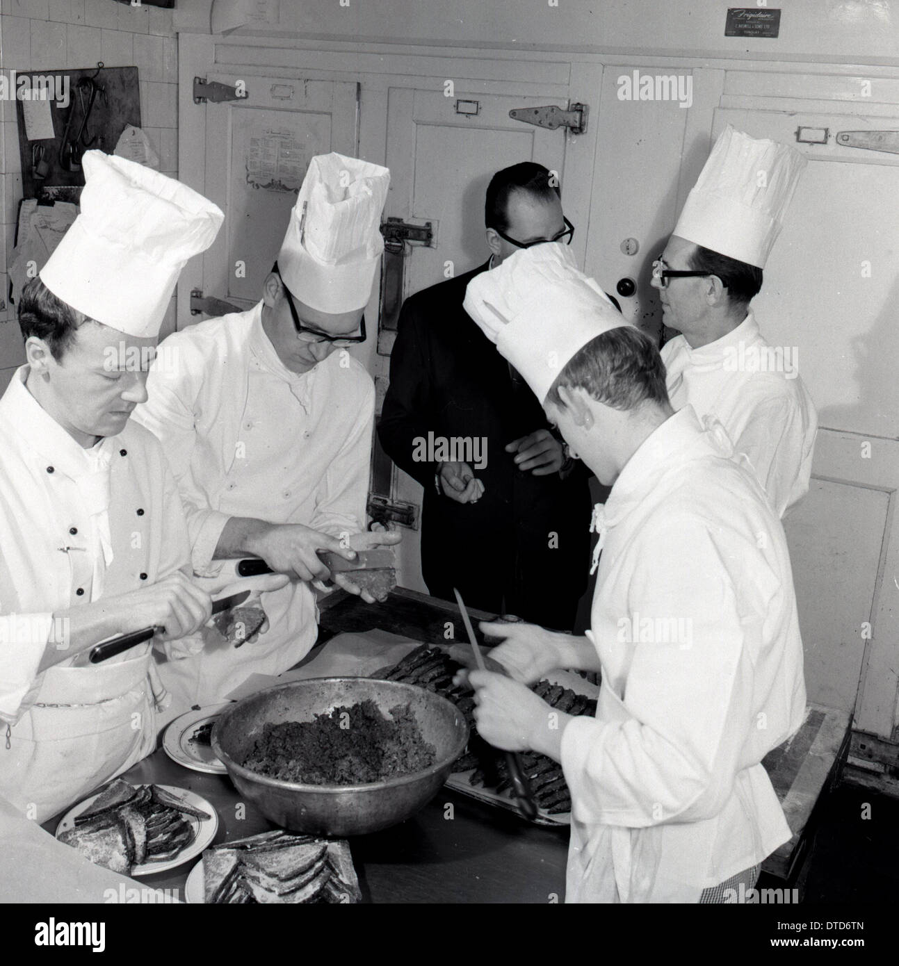 1960s and an historical picture showing of a group of male chefs in a ...