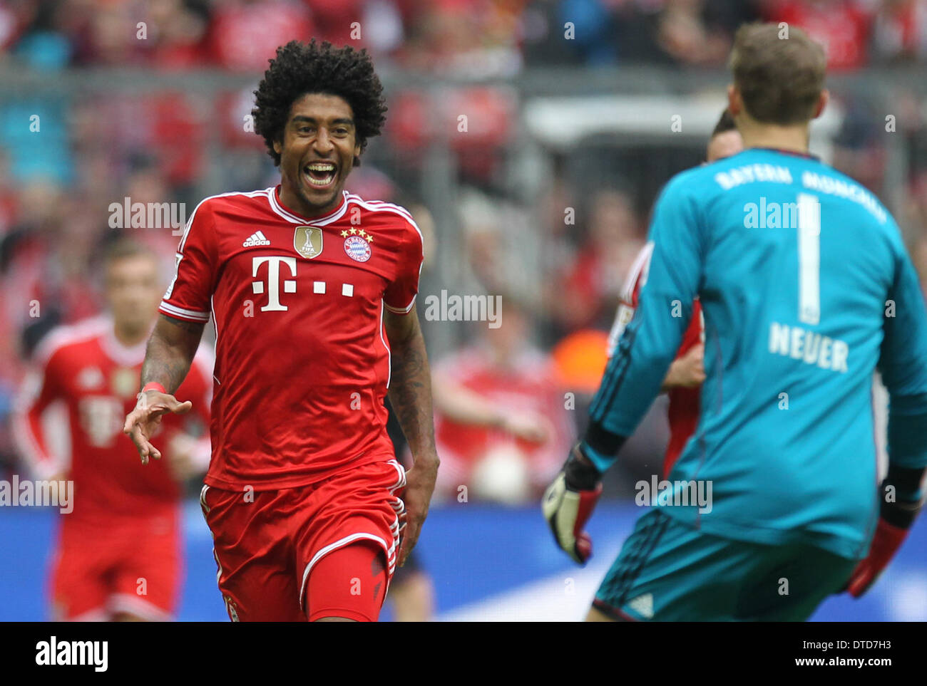 Munich, Germany. 15th Feb, 2014. Munich's Dante (L) celebrates his 1-0 ...