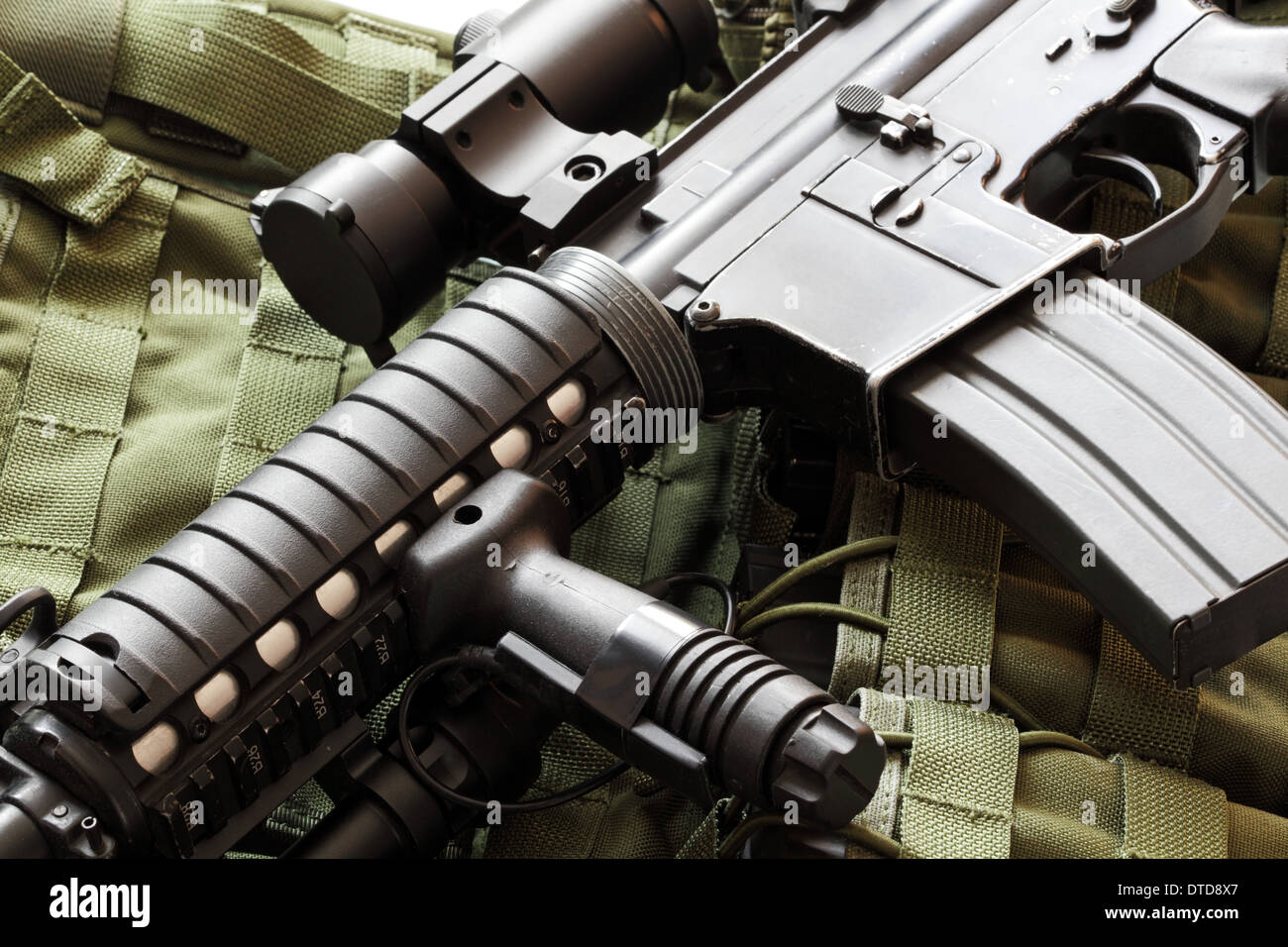 Military still life. AR-15 carbine (The Black Rifle) and tactical vest ...