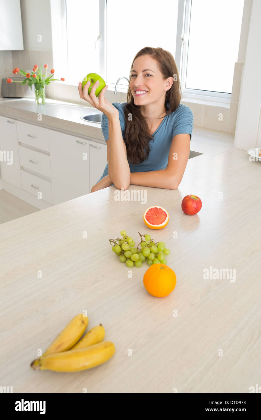 Woman sitting on kitchen counter hi-res stock photography and images ...