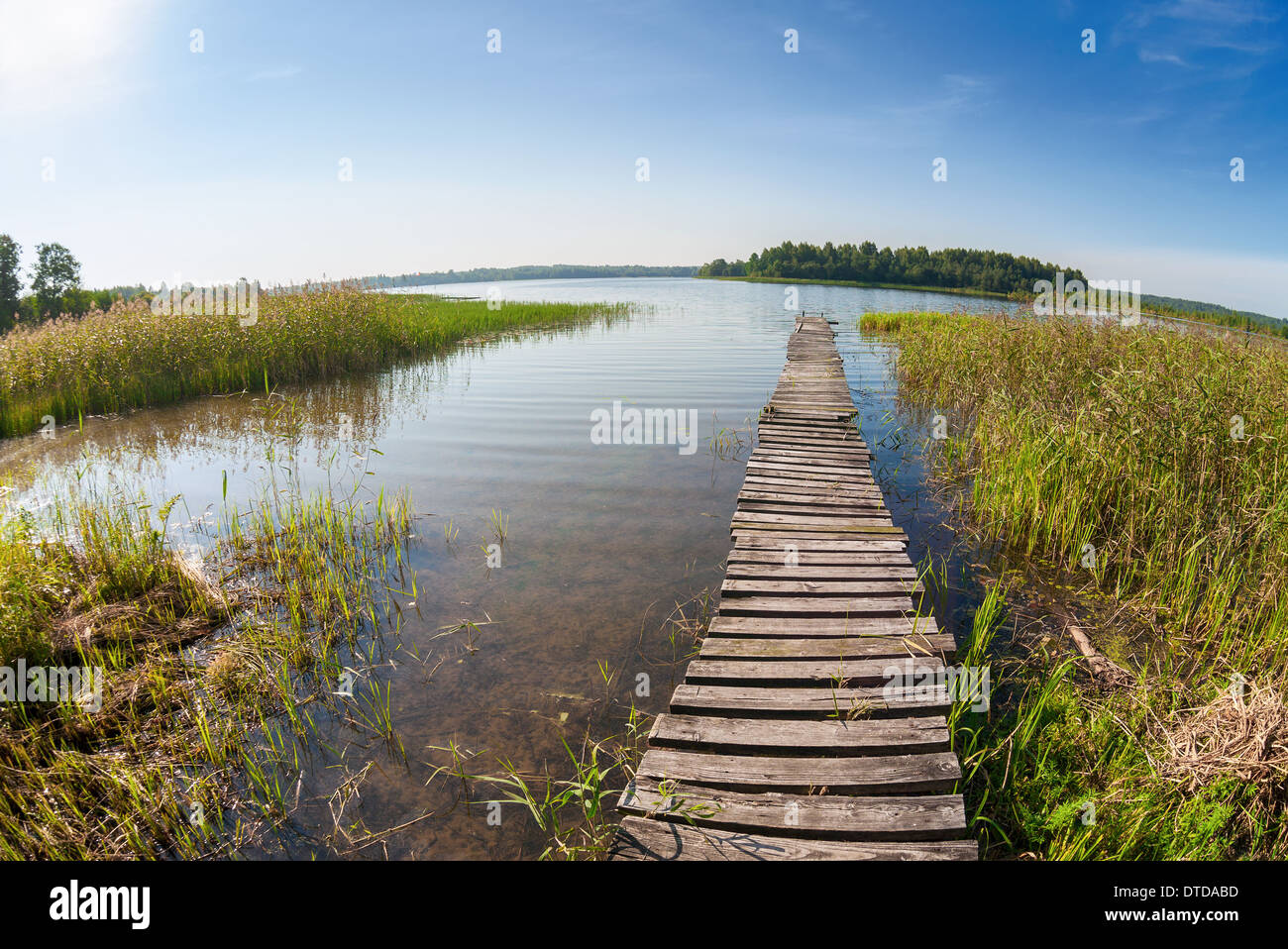 Summer landscape with lake and old wooden bridge Stock Photo - Alamy