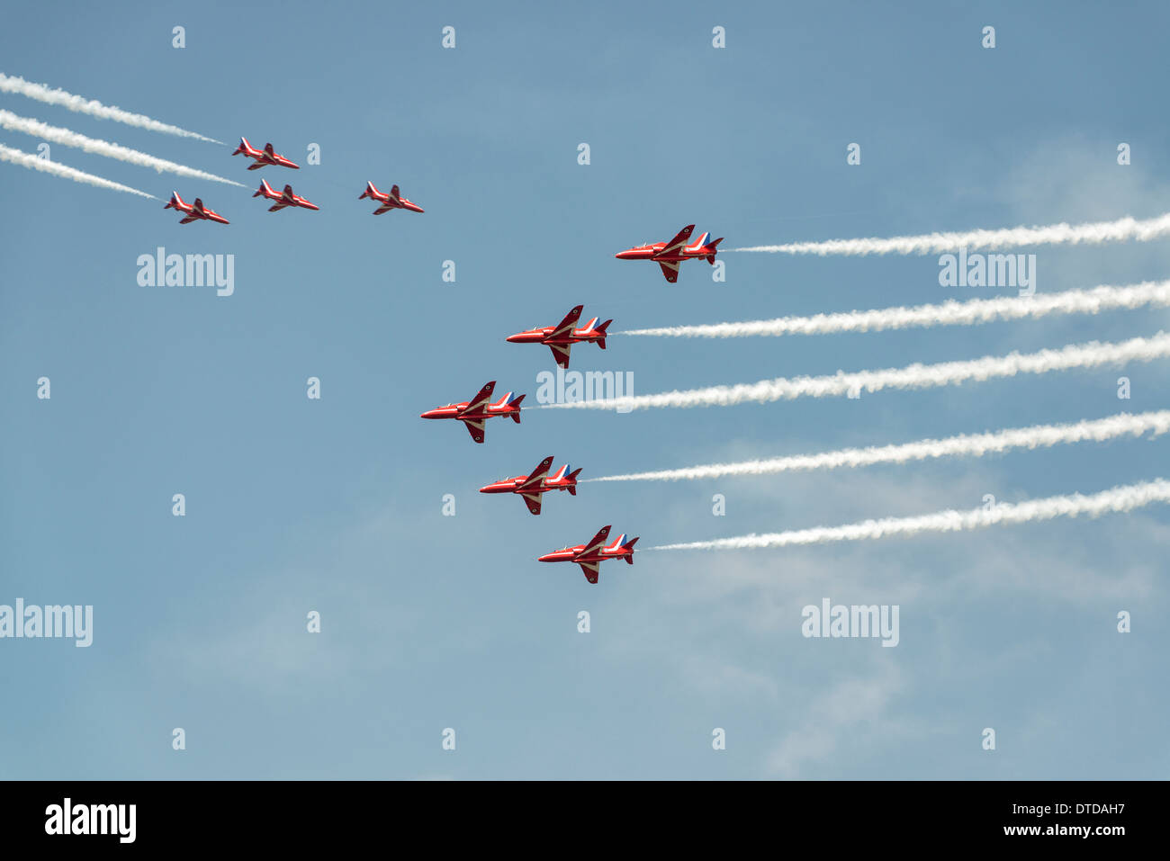 The nine aircraft of the RAF Red Arrows Aerobatic display team split ...