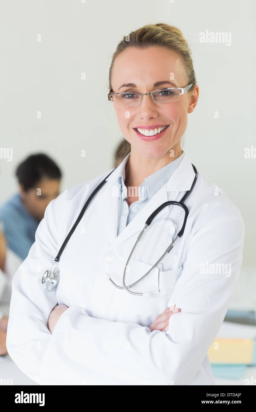 Beautiful doctor nurse smiling arms hi-res stock photography and images - Alamy