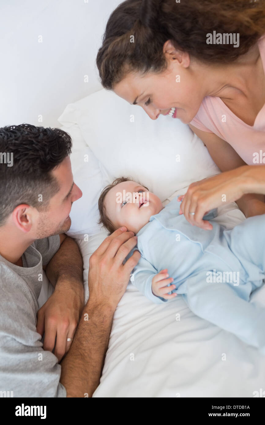 Caring parents with baby boy Stock Photo - Alamy