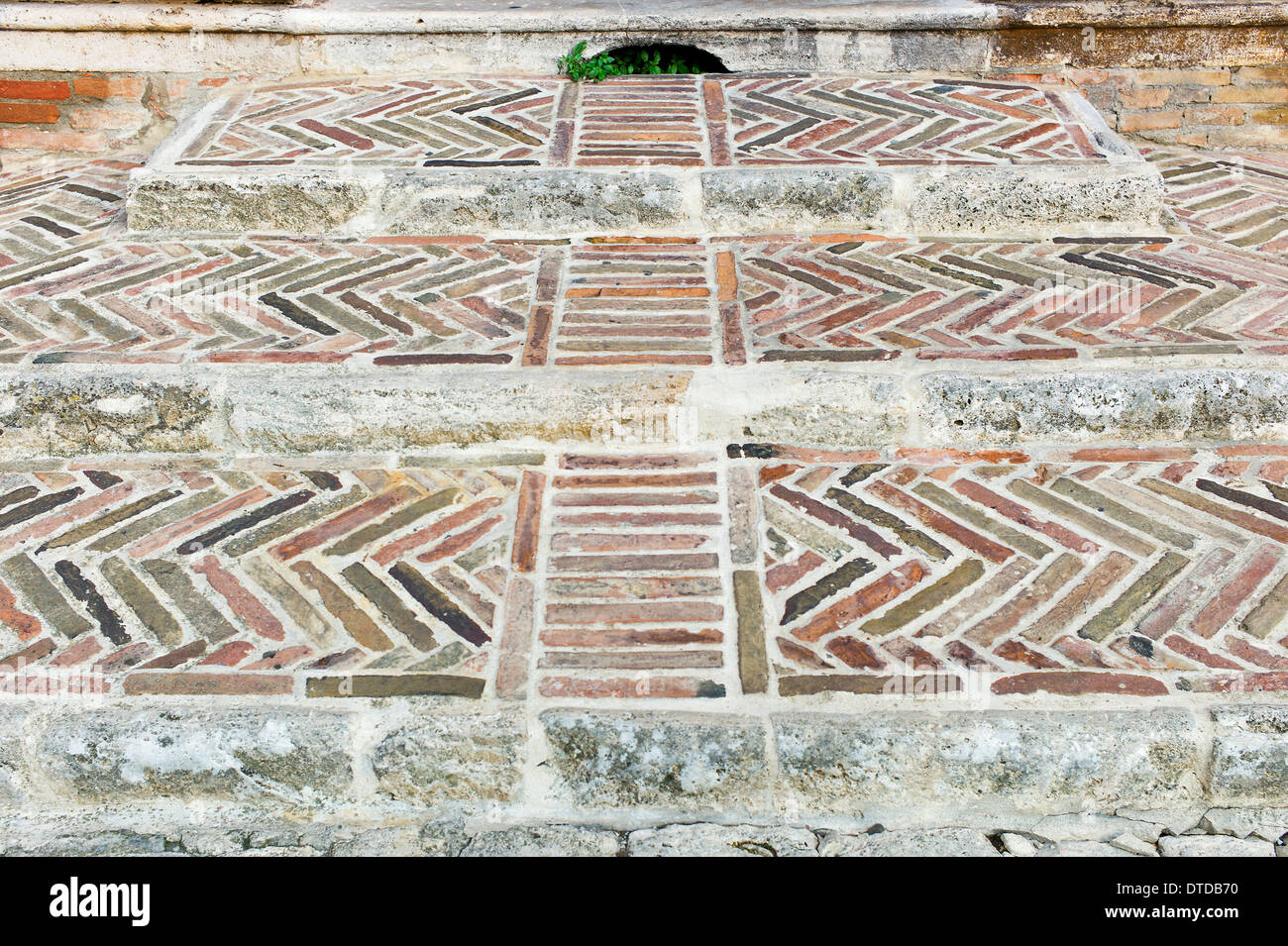 Decorative brick paving and stone steps in Montepulciano, Tuscany ...