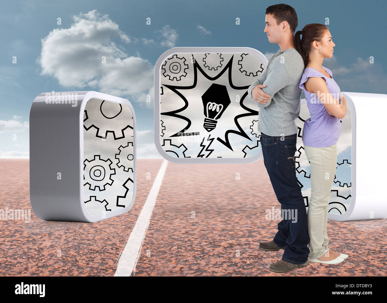 Composite image of young couple standing back to back Stock Photo - Alamy