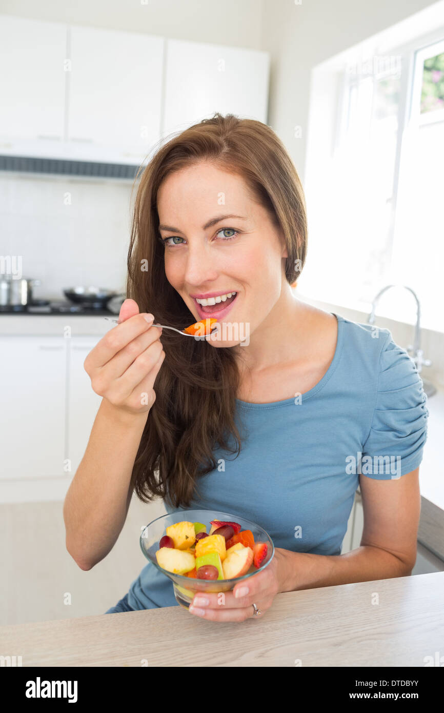Young woman eating fruit salad hi-res stock photography and images - Alamy