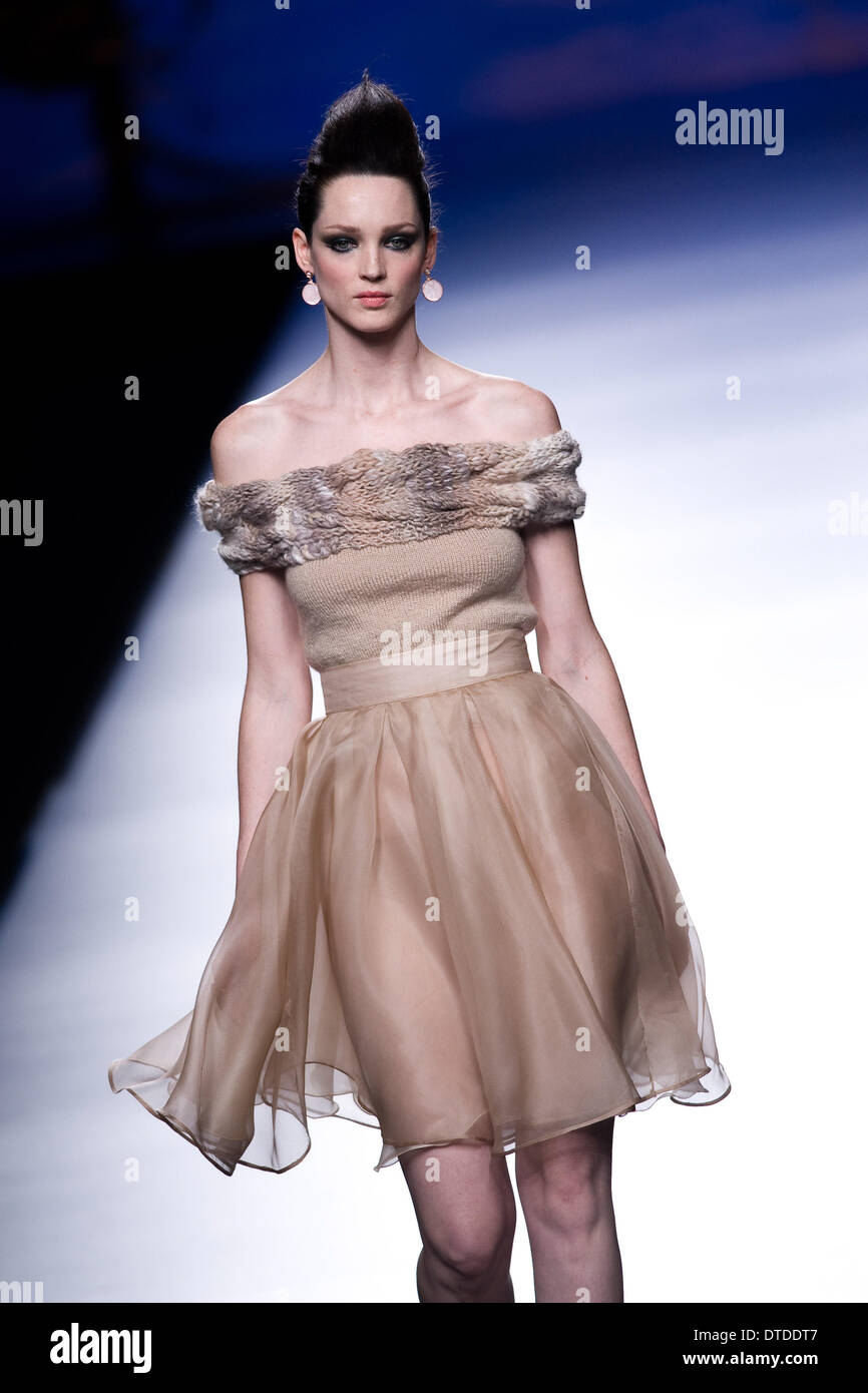 Madrid, Spain. 15th Feb, 2014. A model showcases designs by Francis ...