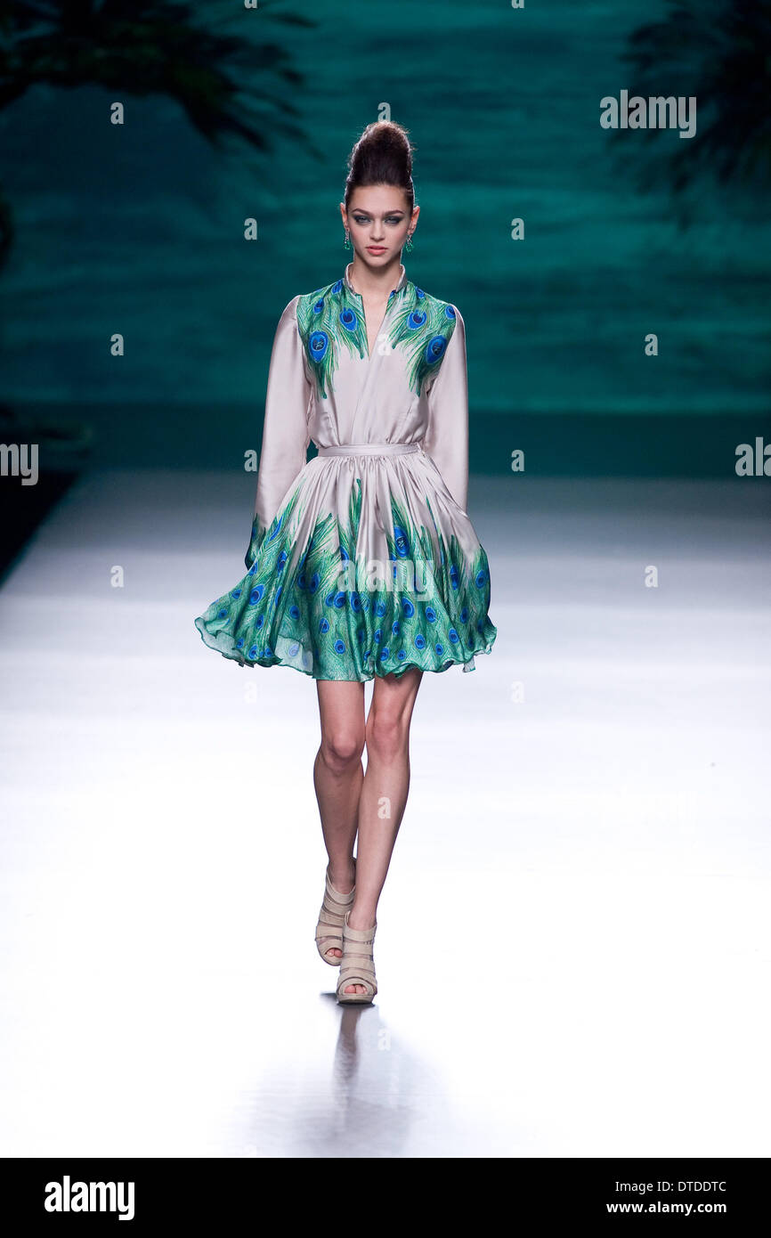 Madrid, Spain. 15th Feb, 2014. A model showcases designs by Francis ...