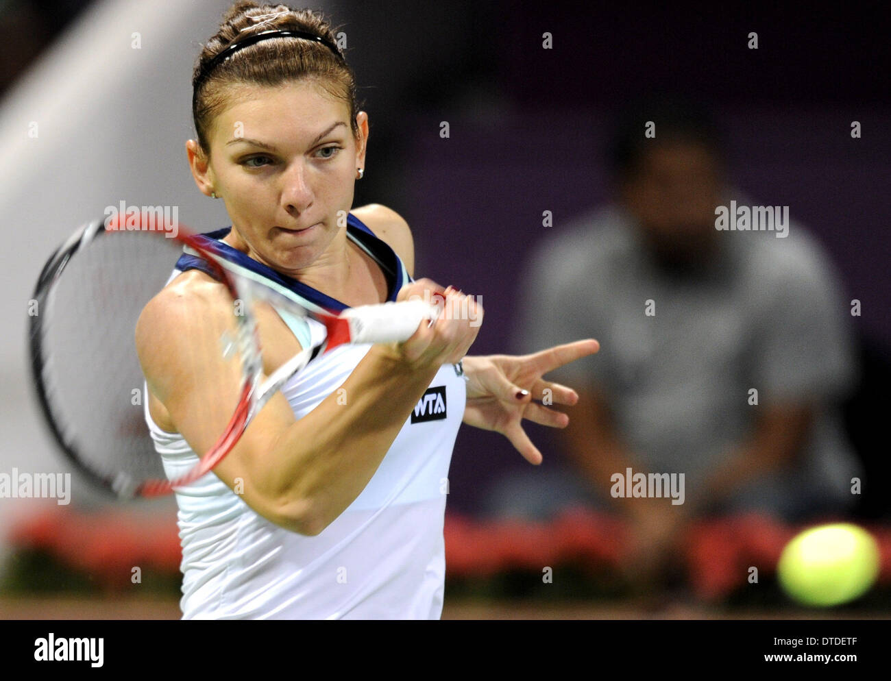 Doha, Qatar. 15th Feb, 2014. Simona Halep of Romania hits a return ...