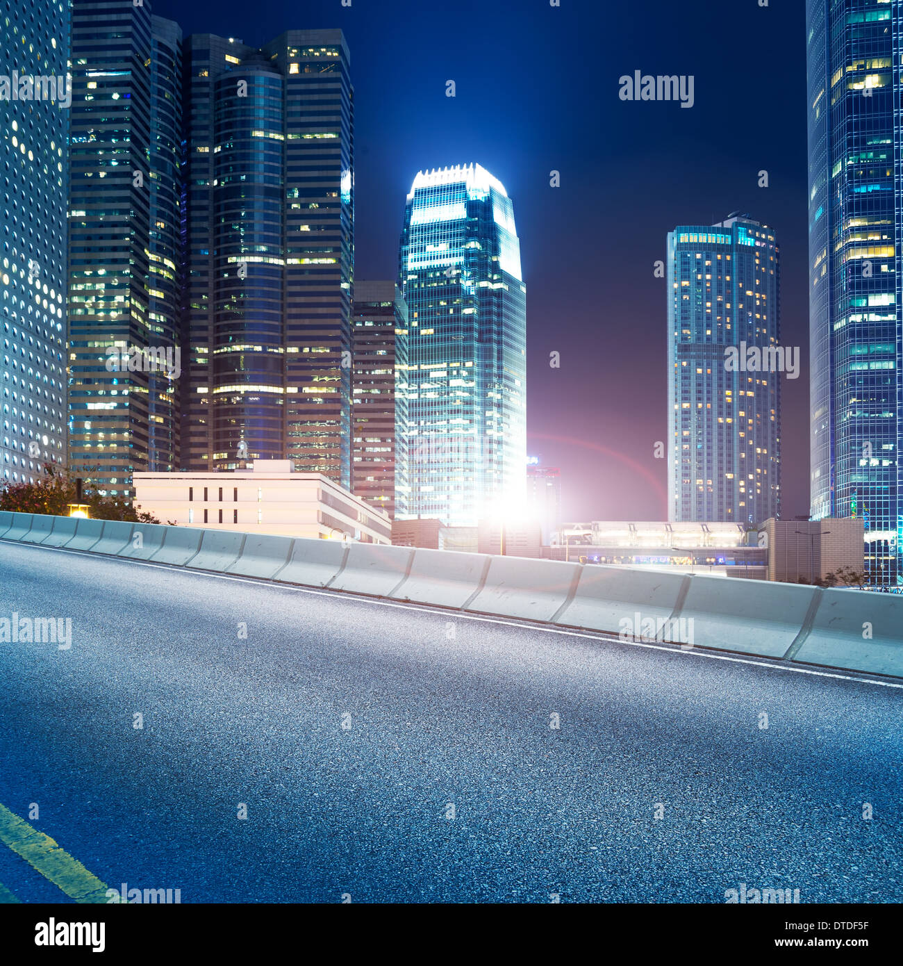 Highway and city at night Stock Photo - Alamy