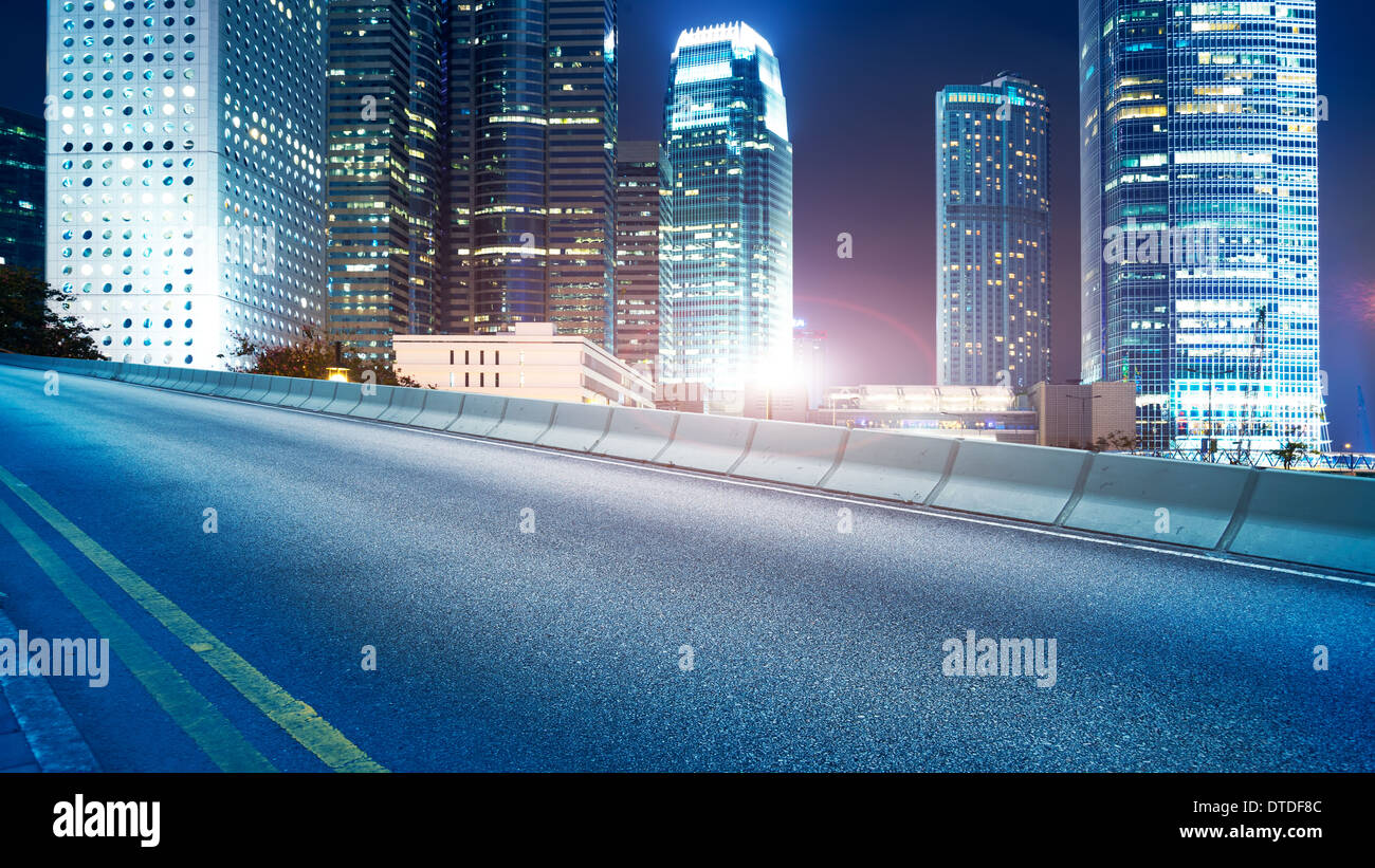 Highway and city at night Stock Photo - Alamy