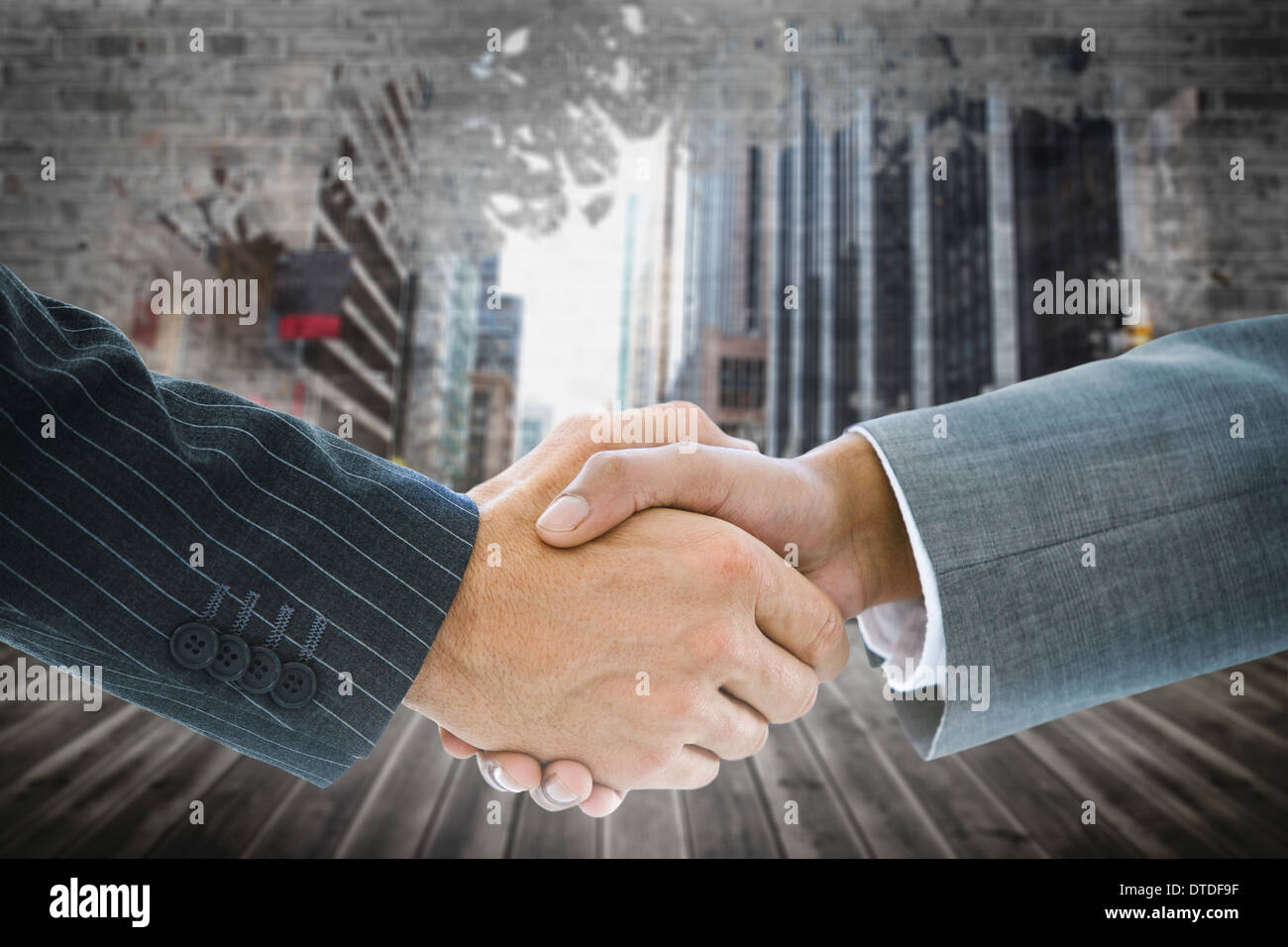 Composite image of business handshake against hexagons on blue ...