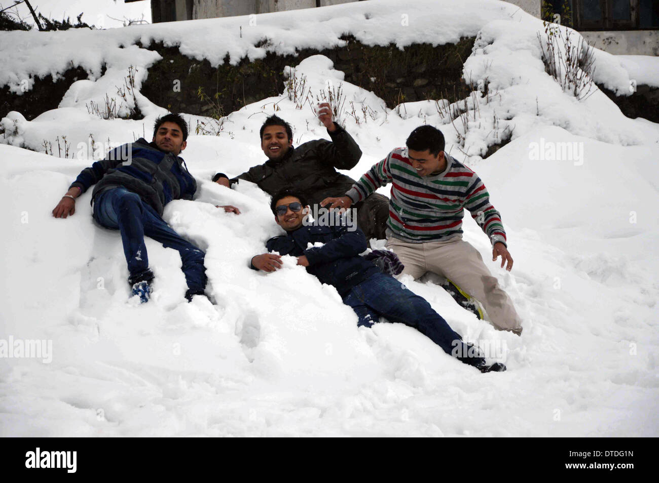 Mussoorie, India. 15th Feb, 2014. People play with snow in Mussoorie ...