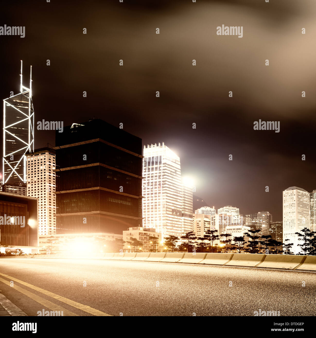 Highway and city at night Stock Photo - Alamy