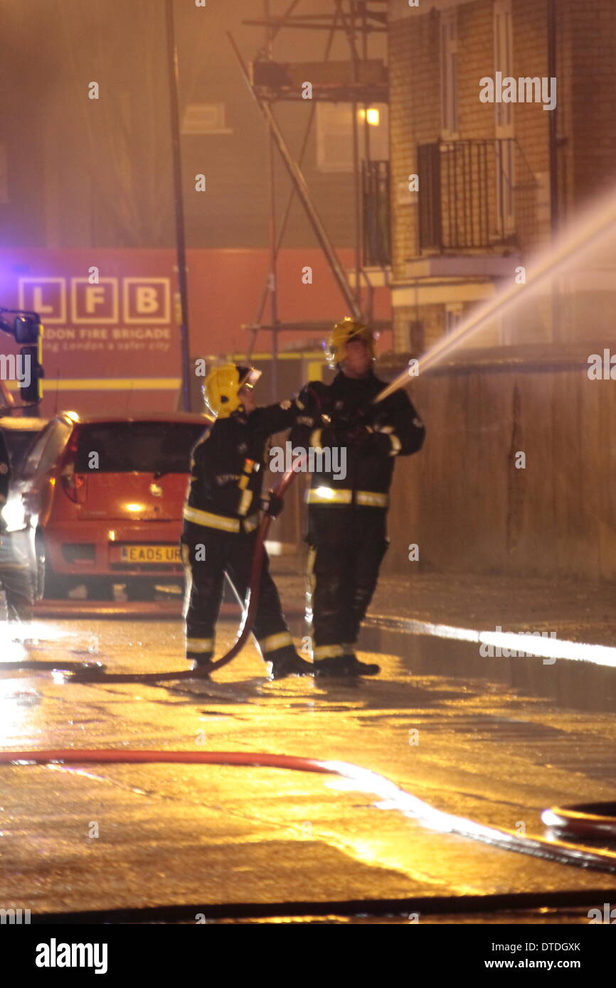 Firefighters at the scene of a fire in canning town hi-res stock ...