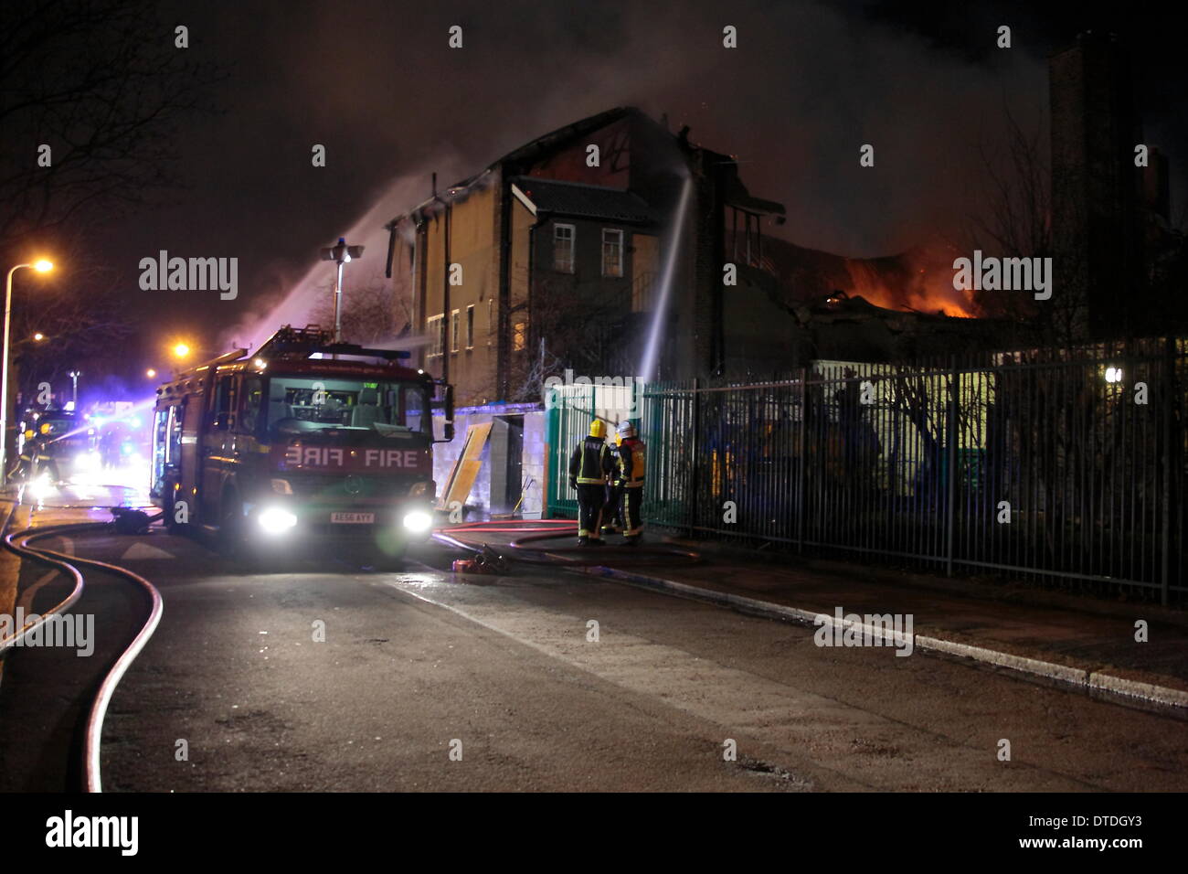 Firefighters at the scene of a fire in canning town hi-res stock ...