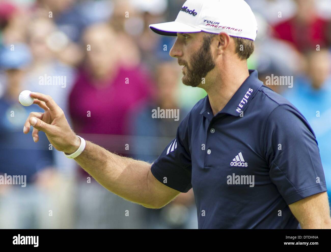 Los Angeles, California, USA. 15th Feb, 2014. Dustin Johnson waves ...
