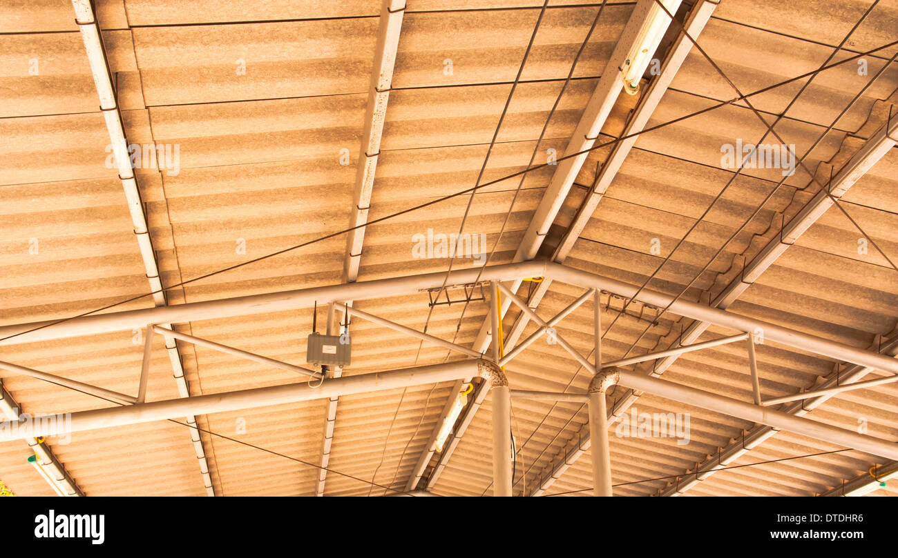 Under the roof of the structure with steel poles Stock Photo - Alamy
