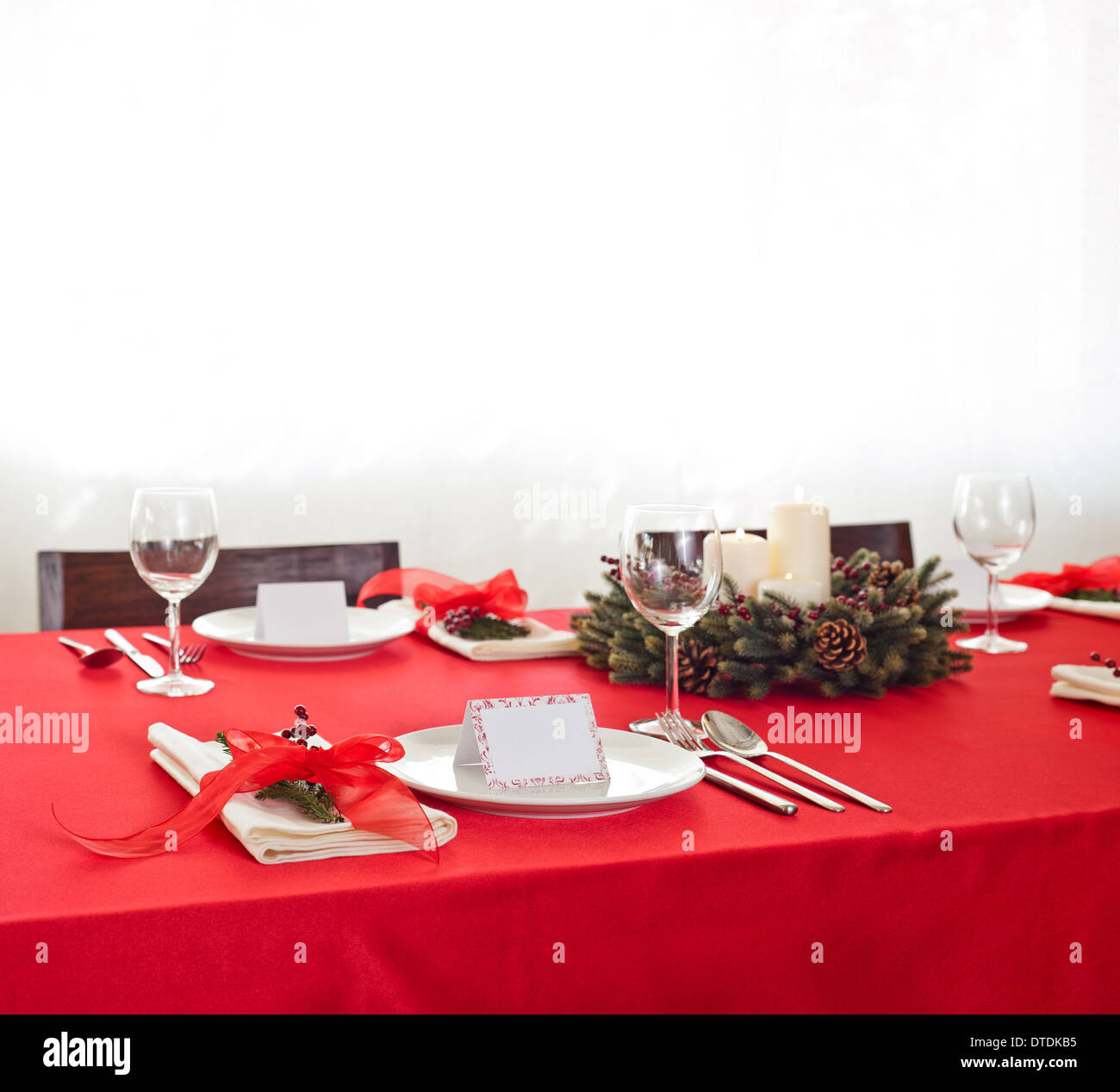 Red dinner table setup with name place card Stock Photo - Alamy