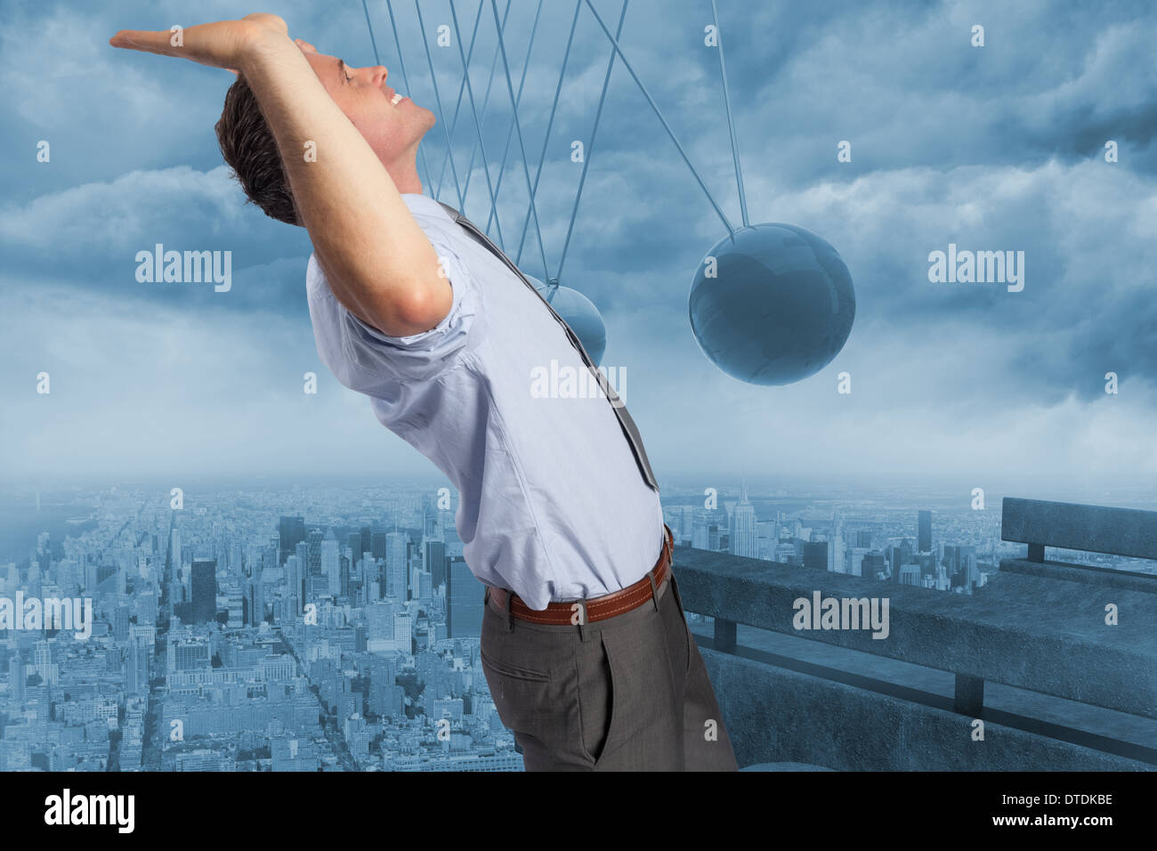 Composite image of businessman standing with hands up Stock Photo - Alamy