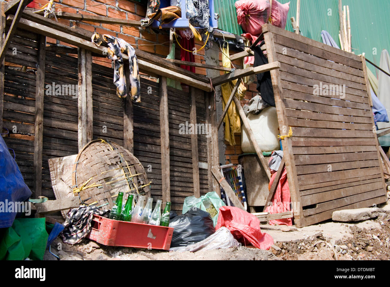 A squatters home and posessions are leaning against a wall on a city ...