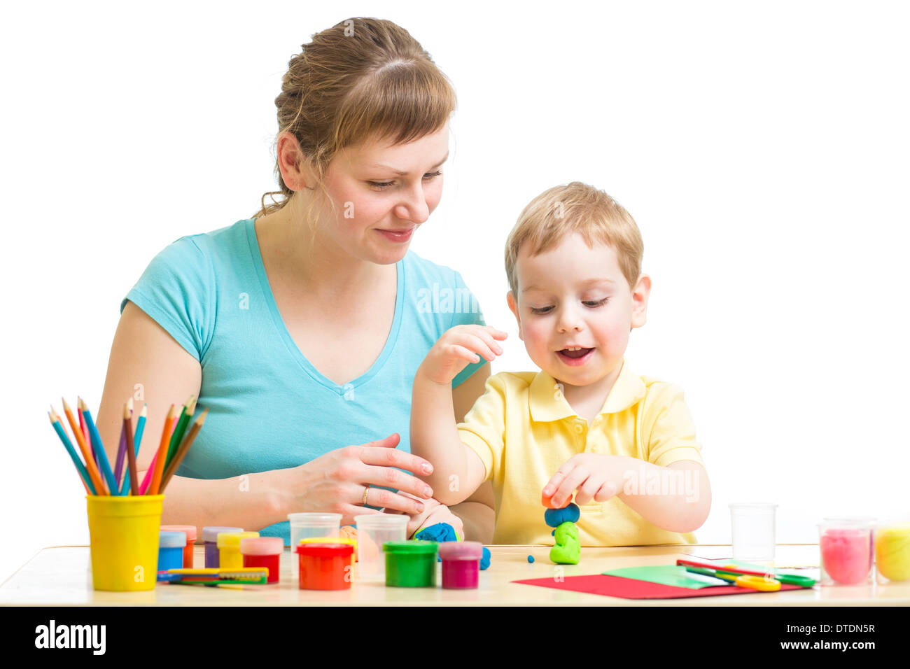Parent and child plasticine modeling together isolated on white Stock ...