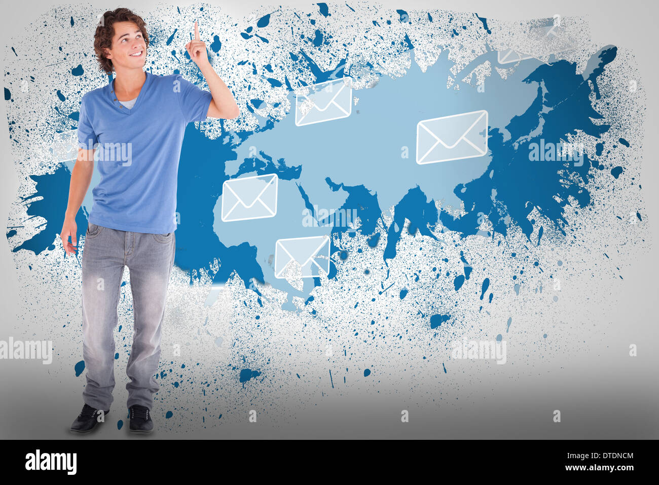 Composite image of handsome guy pointing Stock Photo - Alamy