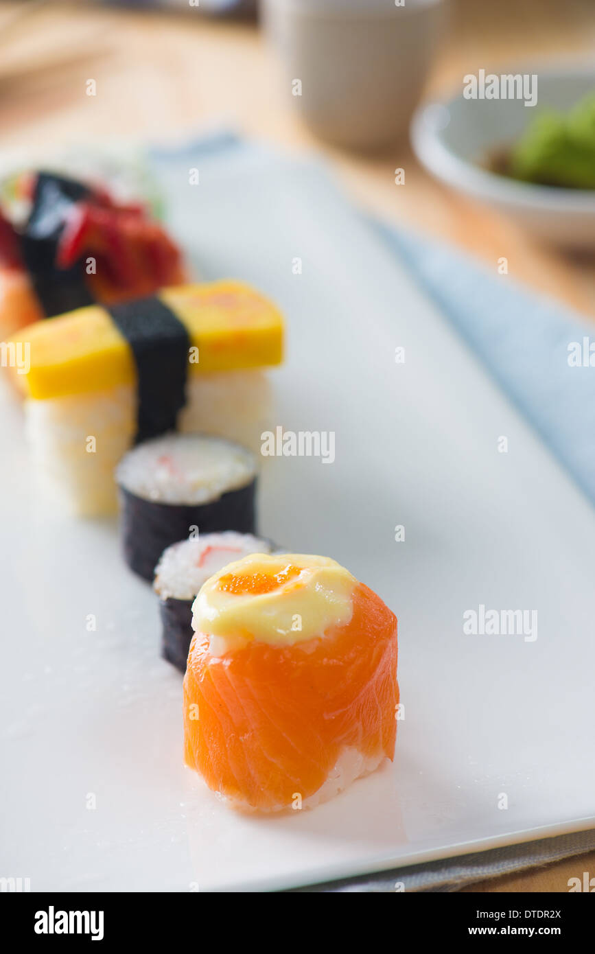 Salmon and caviar rolls served on a plate Stock Photo - Alamy