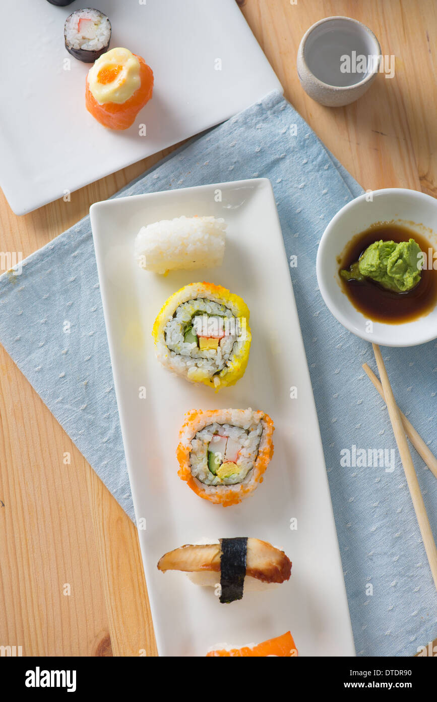 Salmon and caviar rolls served on a plate Stock Photo - Alamy