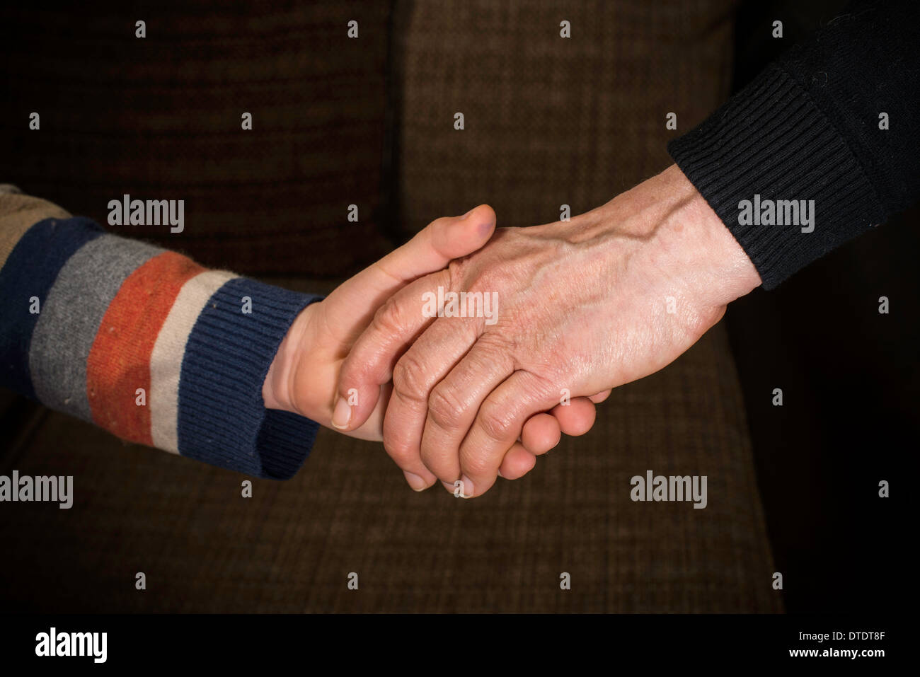 Two hands caught. Adult and child hand Stock Photo - Alamy