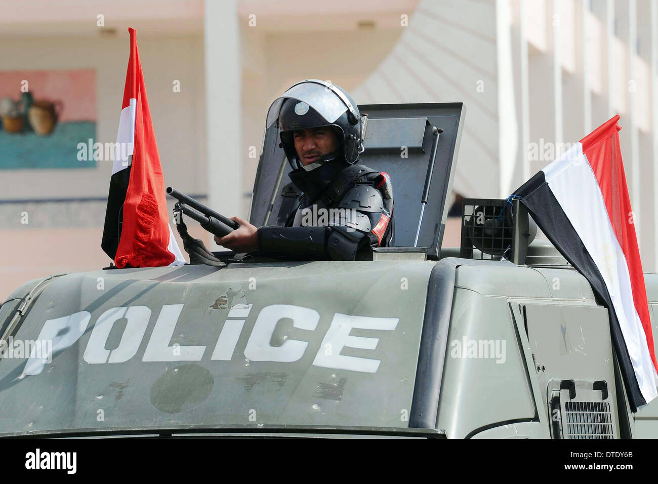 Cairo, Cairo, Egypt. 16th Feb, 2014. An Egyptian riot policeman stands ...