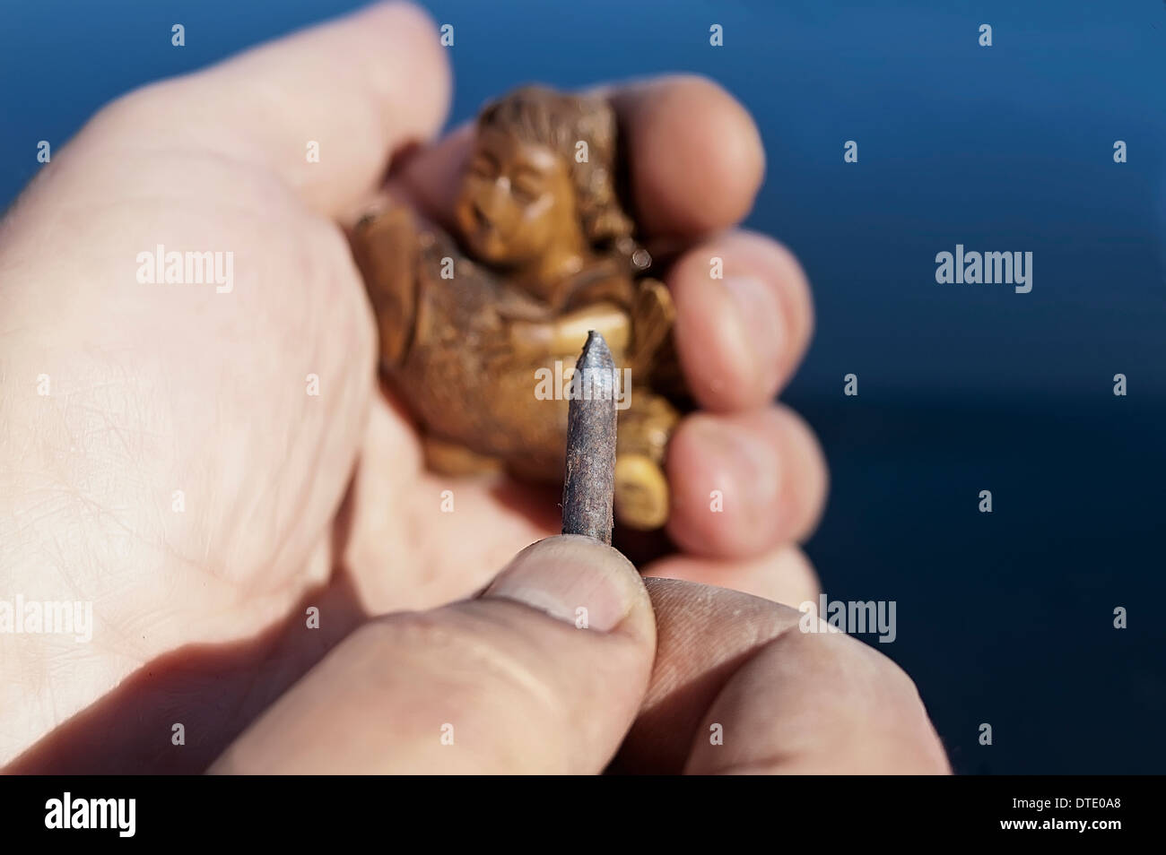 man hand carving wooden statue Stock Photo - Alamy