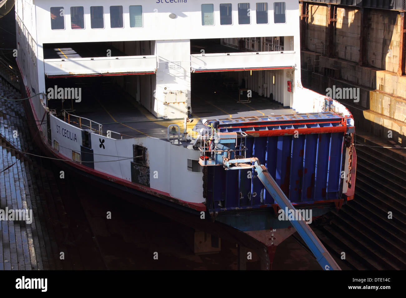 A contractor working on a car and passenger ferry while in dry Stock ...