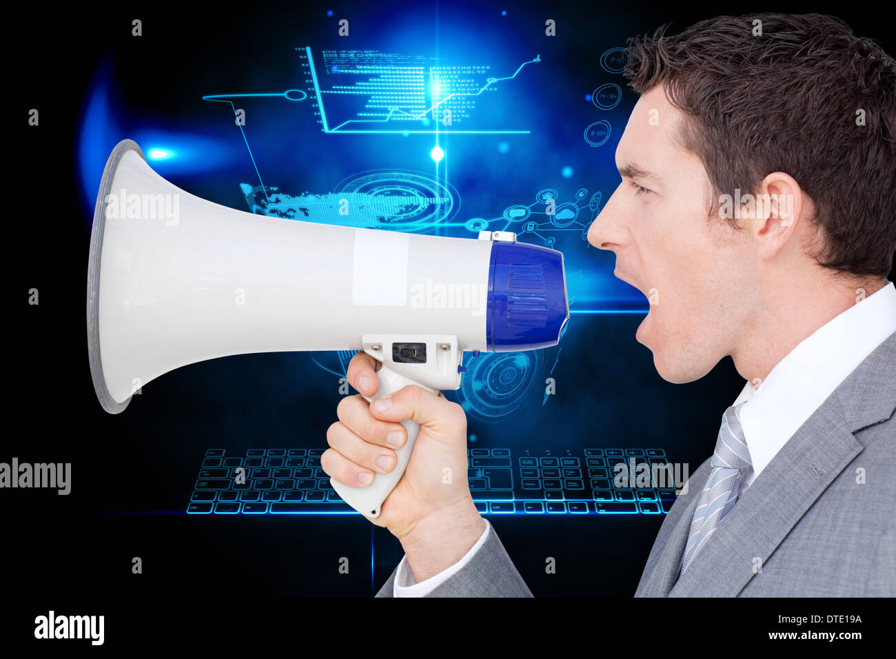Composite image of businessman using a megaphone Stock Photo - Alamy