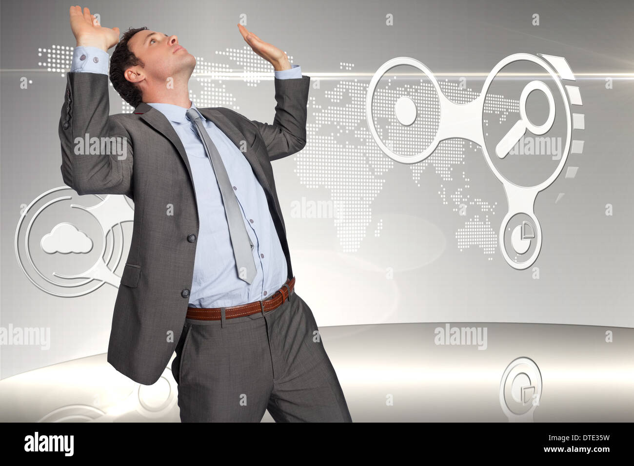 Composite image of businessman standing with arms pressing up Stock ...