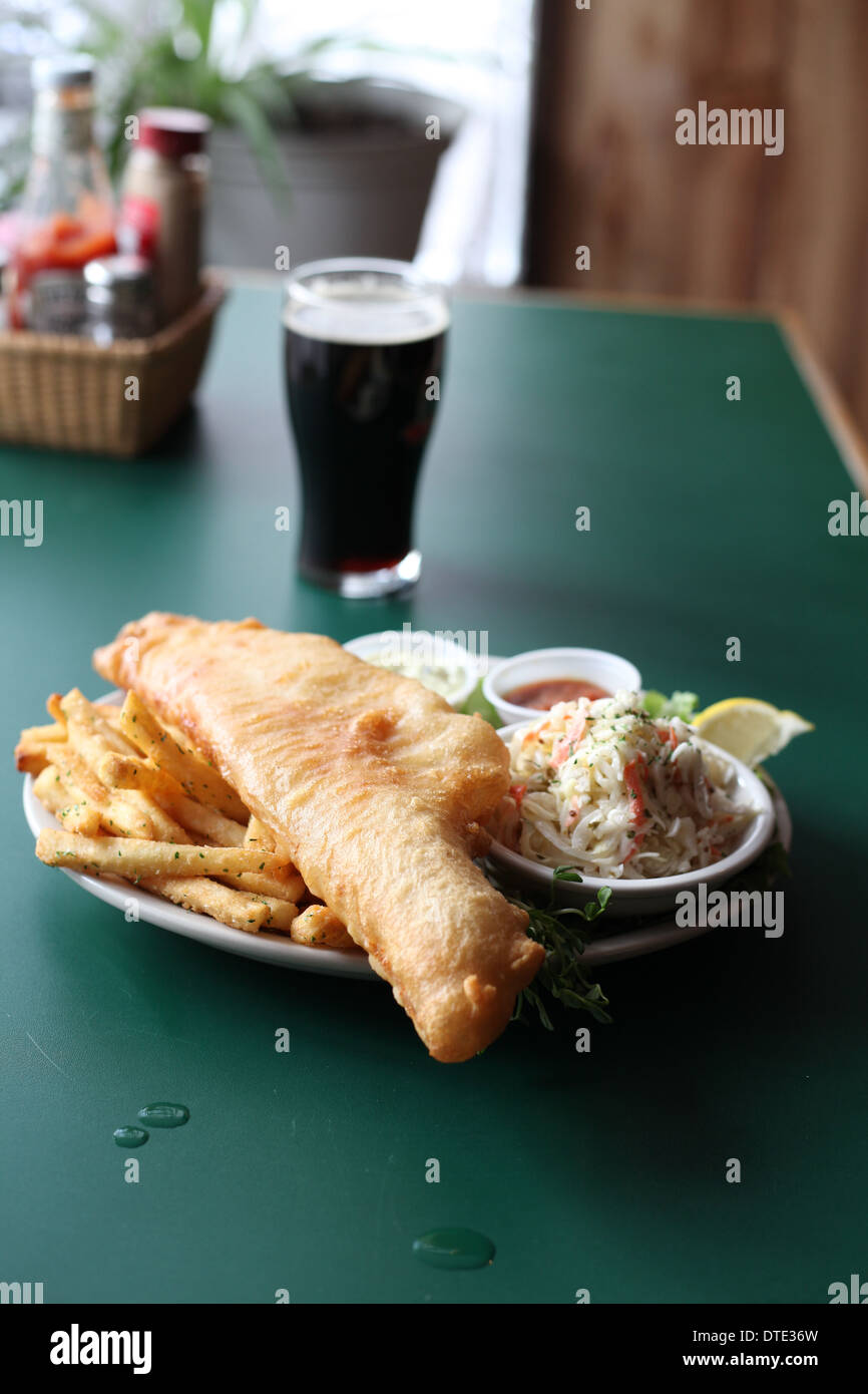 Fish & Chips with a pint of stout beer Stock Photo - Alamy