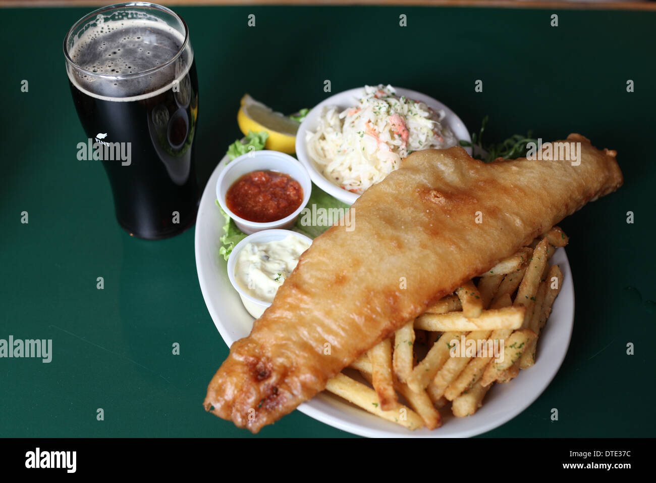 Fish & Chips with a pint of stout beer Stock Photo - Alamy
