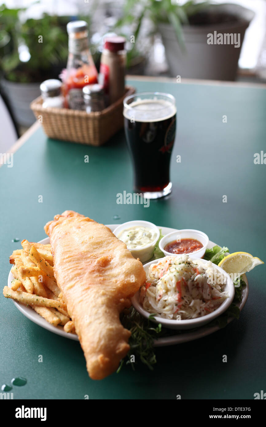 Fish & Chips with a pint of stout beer Stock Photo - Alamy
