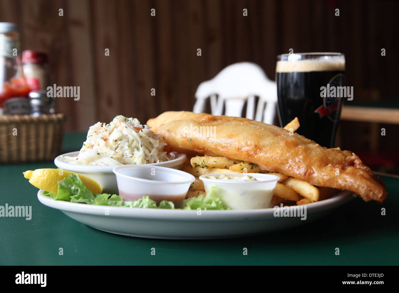 Fish & Chips with a pint of stout beer Stock Photo - Alamy