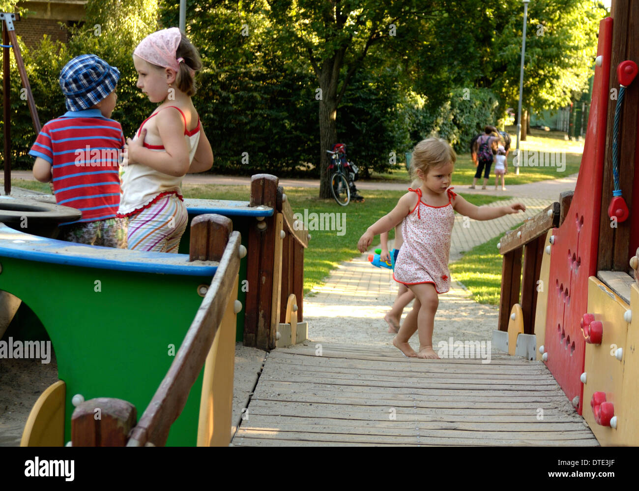 Children playing at playground Stock Photo - Alamy