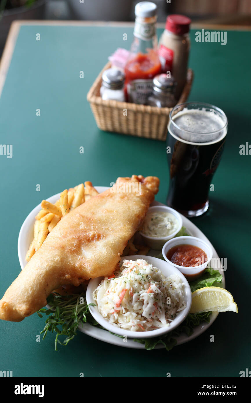Fish & Chips with a pint of stout beer Stock Photo - Alamy