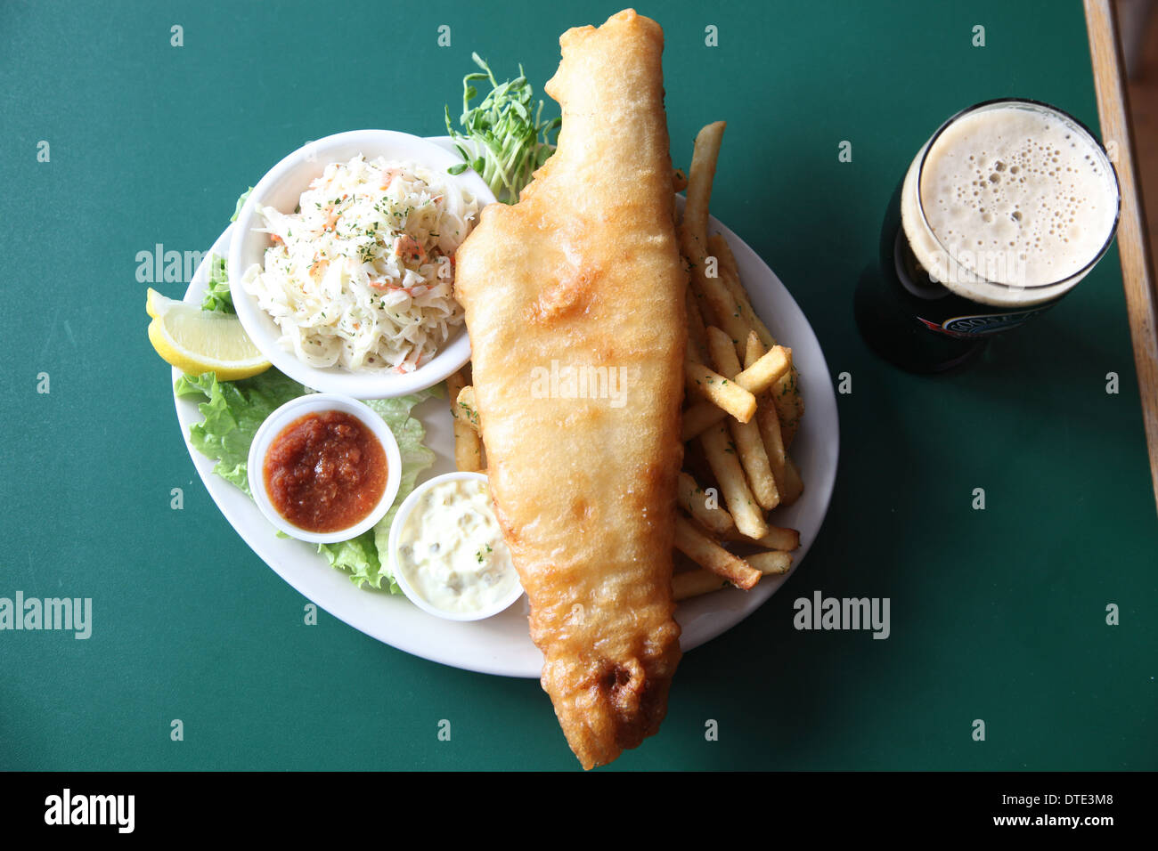 Fish & Chips with a pint of stout beer Stock Photo - Alamy