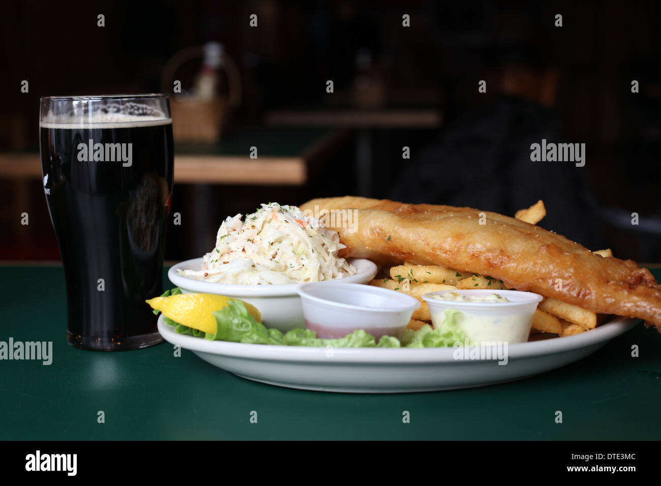 Fish & Chips with a pint of stout beer Stock Photo - Alamy