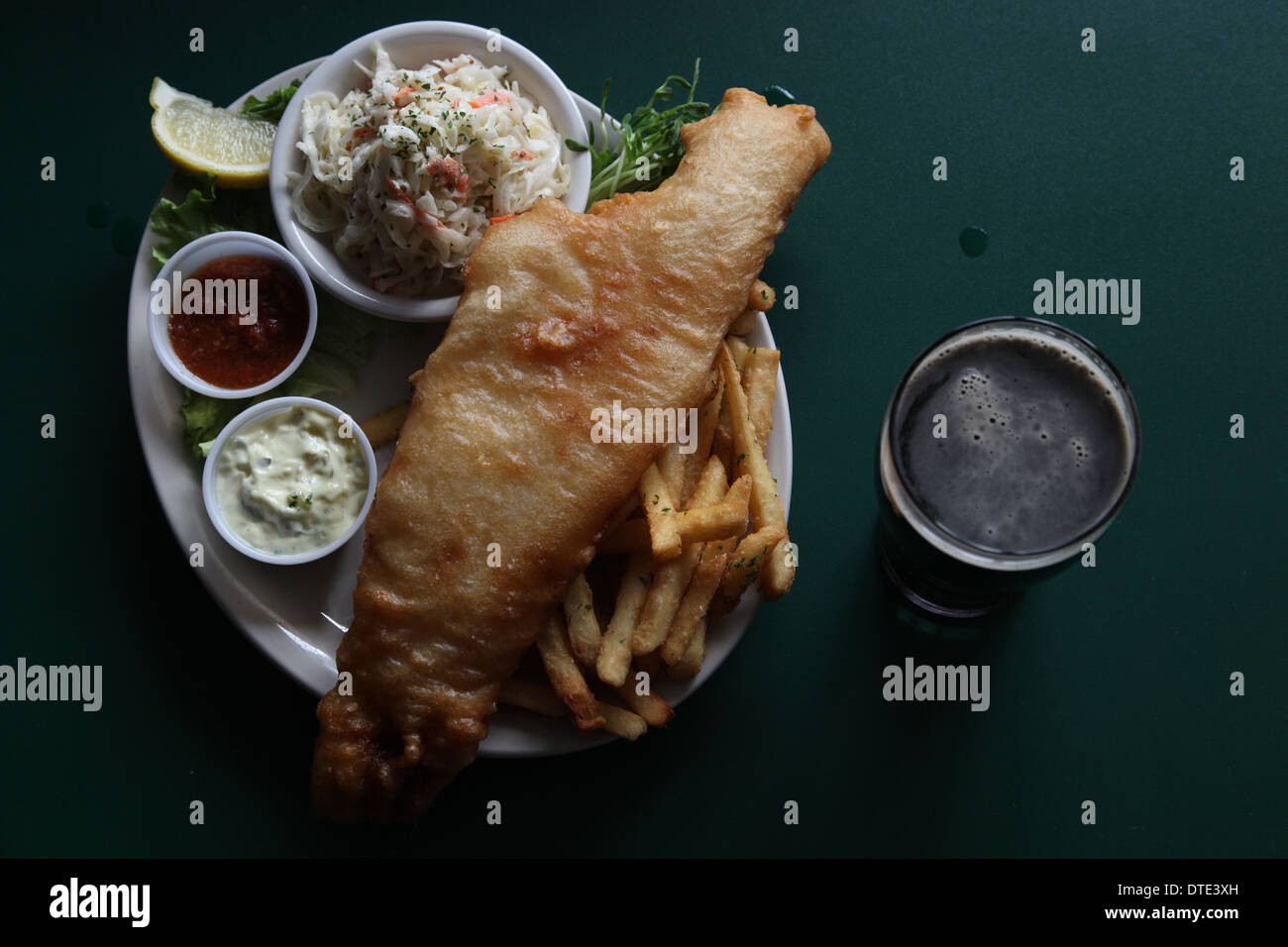 Fish & Chips with a pint of stout beer Stock Photo - Alamy