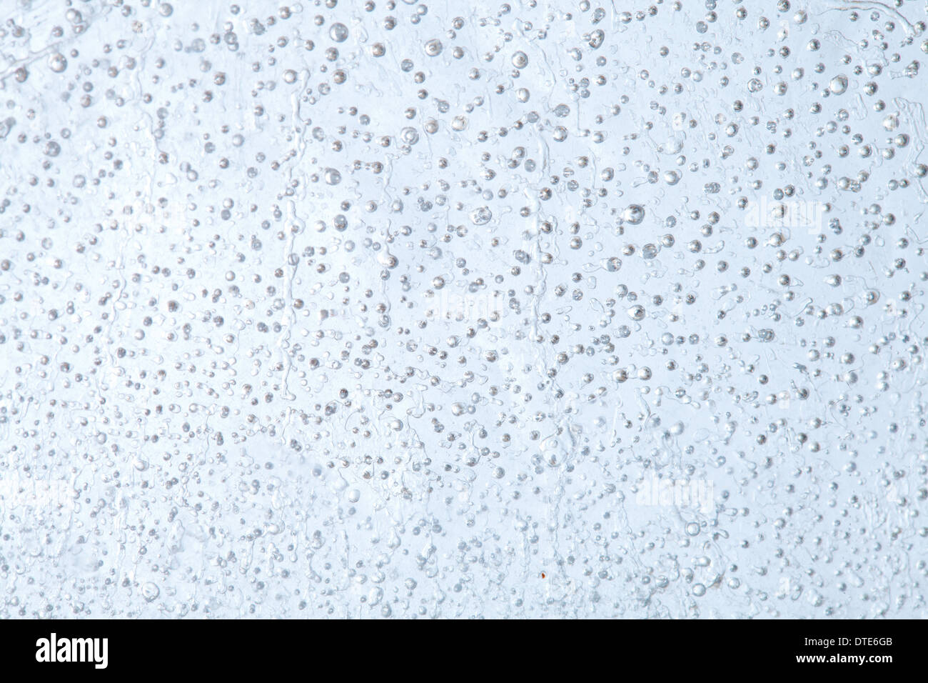 ice with trapped air bubbles natural background Stock Photo - Alamy