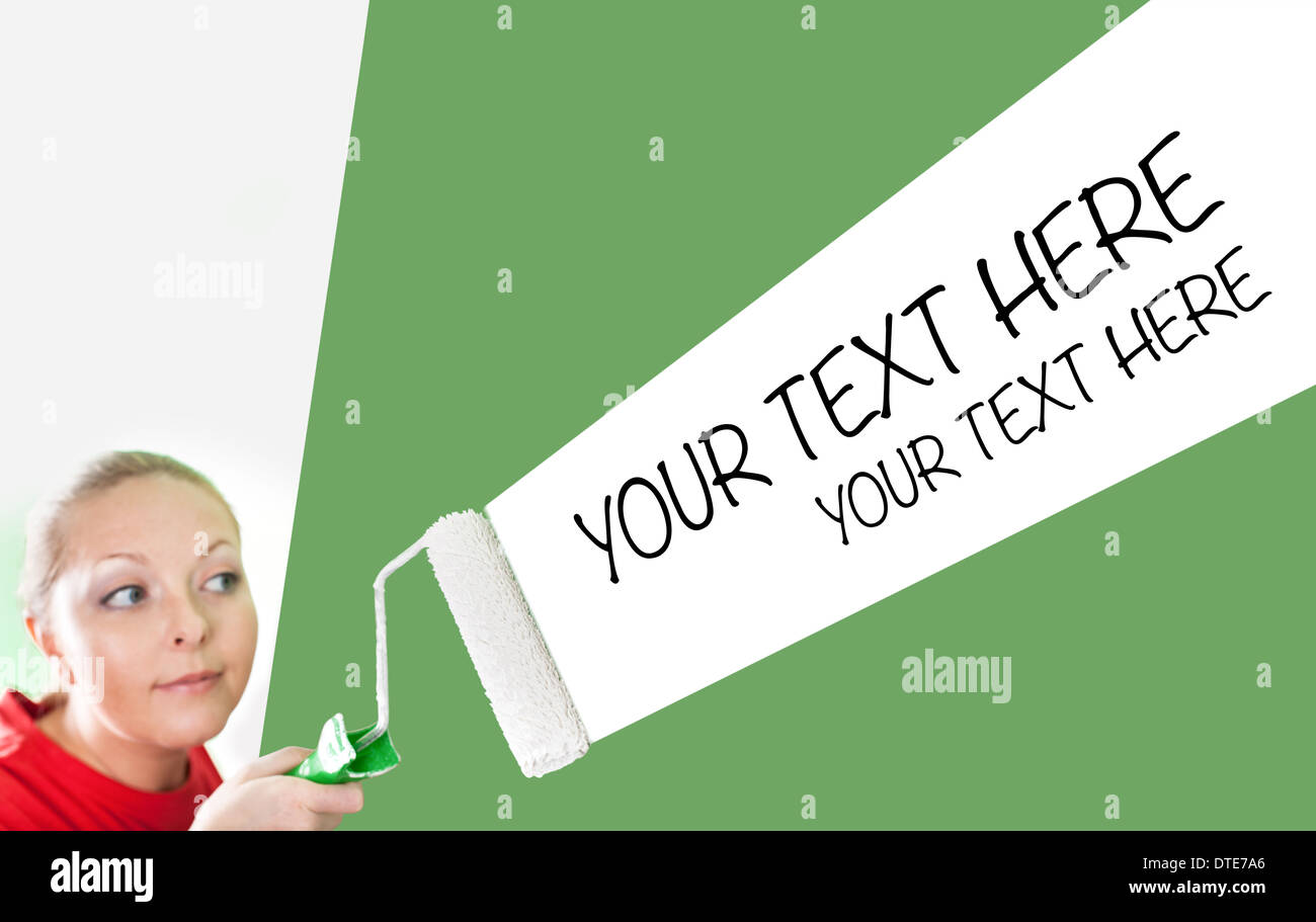 Young woman with paint roller in hand Stock Photo - Alamy