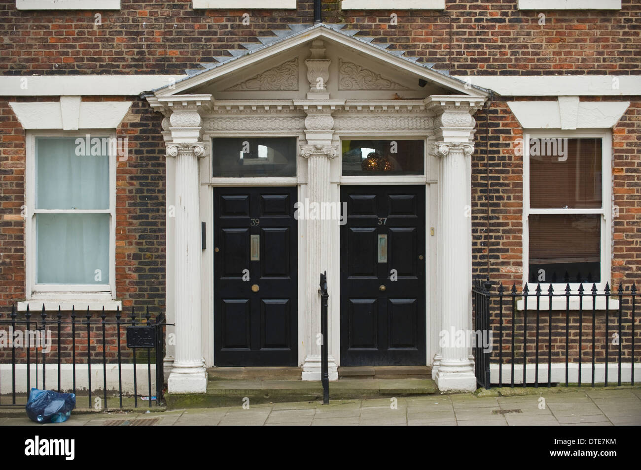 Black number 39 & 37 front doors of houses in Scarborough North ...