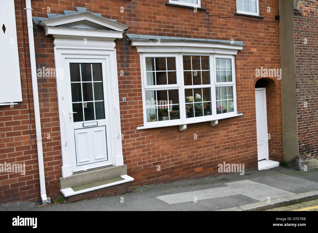 White number 4 plastic front door & window of house in Scarborough ...