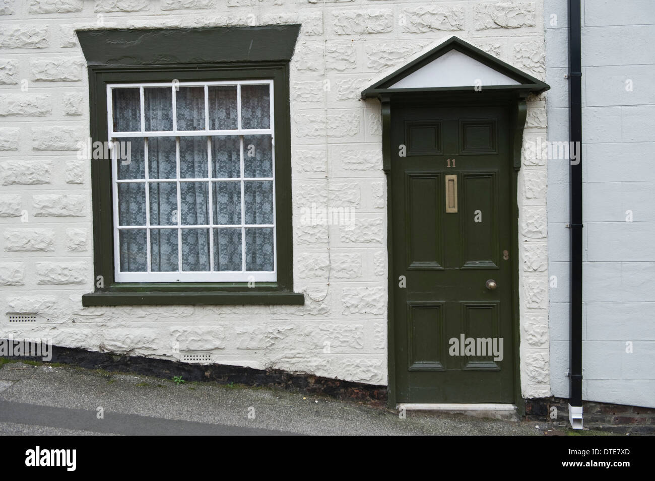 Green number 11 front door & sash window of house in Scarborough North ...